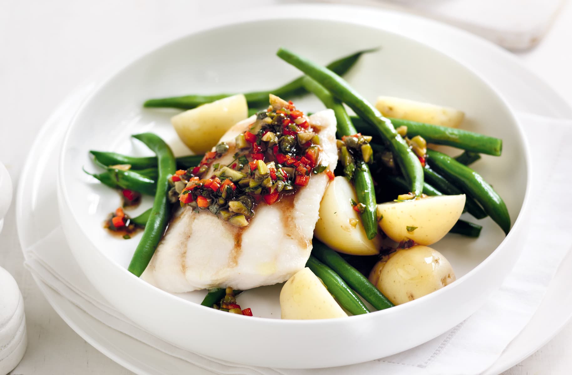 Baked fish with warm Niçoise dressing - Healthy Food Guide
