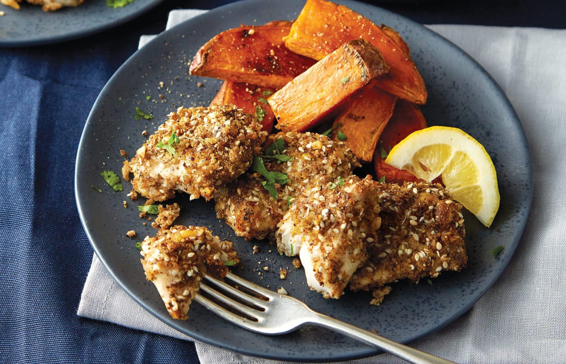 Crispy fish bites with wedges and slaw - Healthy Food Guide