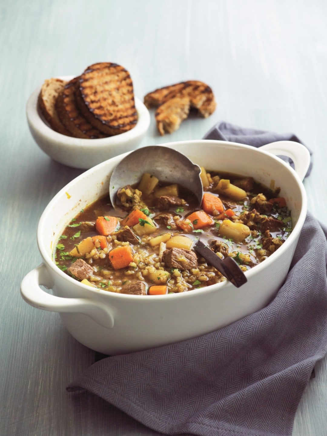 Beef and beer stew with crusty garlic bread - Healthy Food Guide