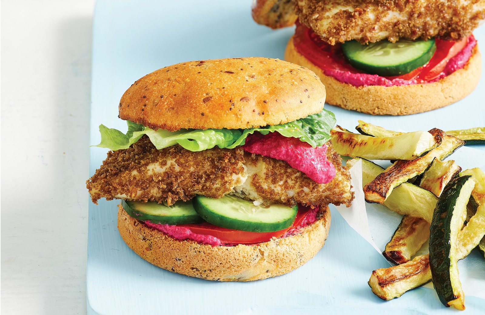 Crumbed fish fillet burgers with beetroot sauce - Healthy Food Guide